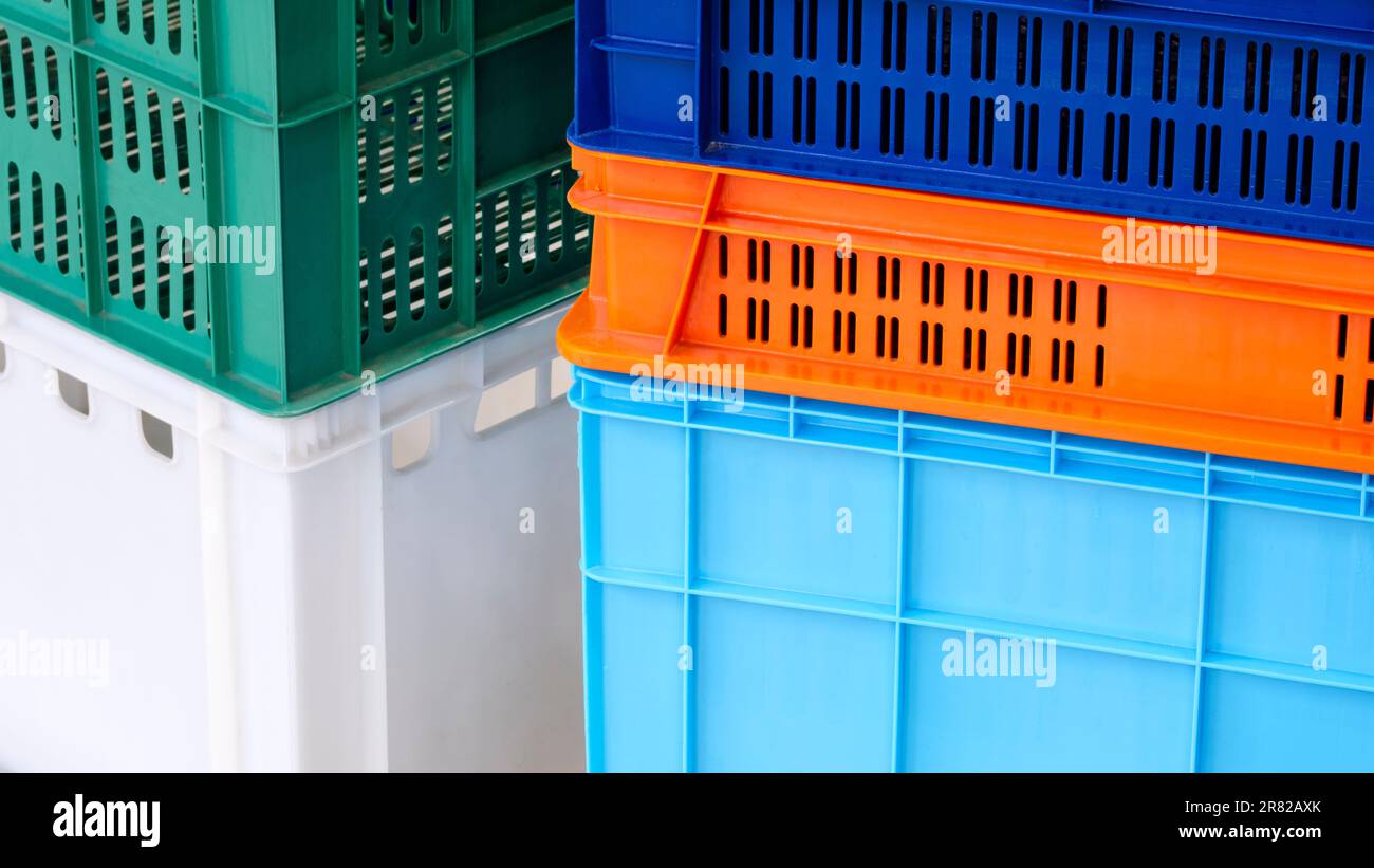 Colorful plastic boxes, logistic concept Stock Photo - Alamy