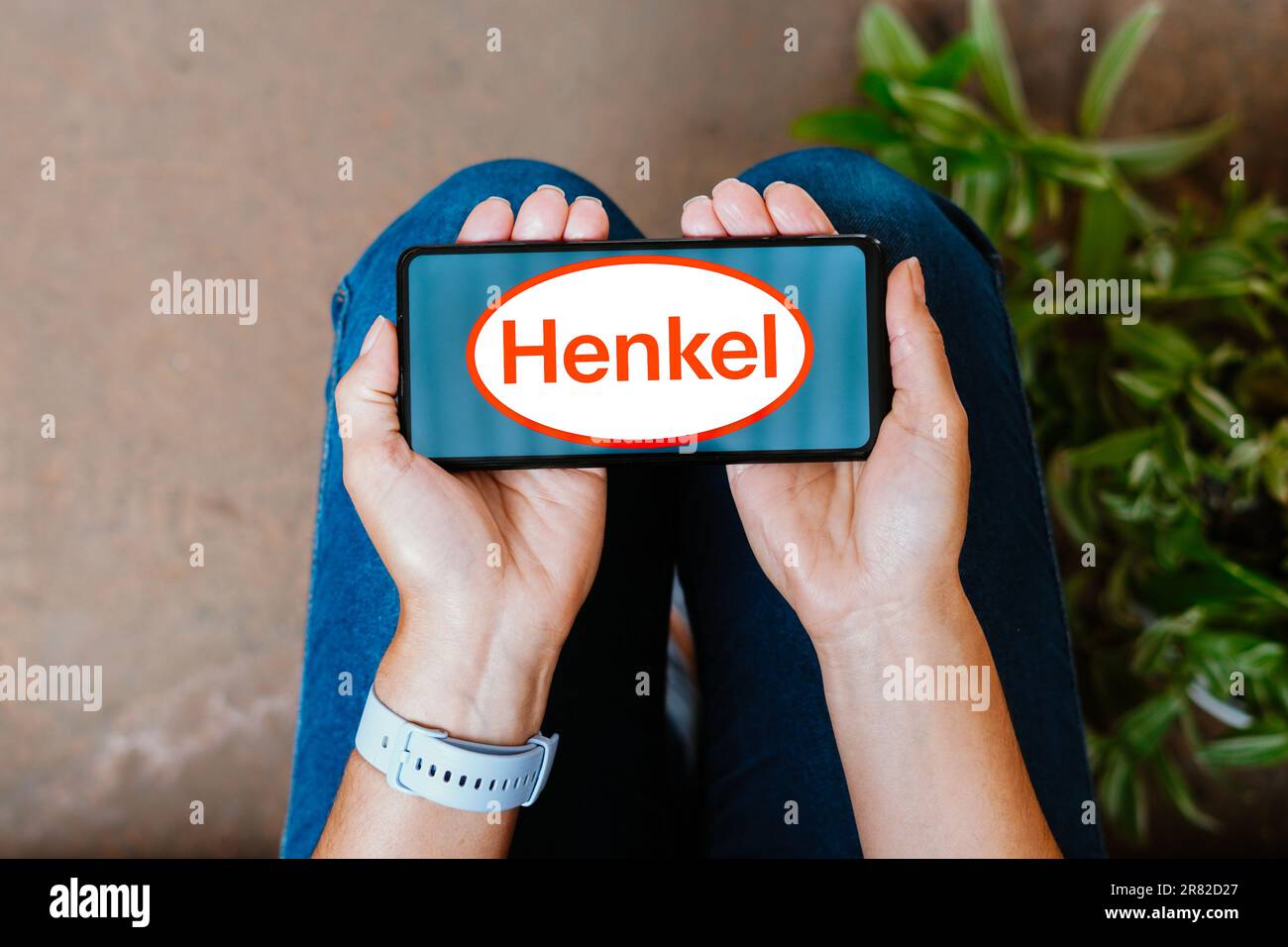 In this photo illustration, the Henkel logo is displayed on a ...
