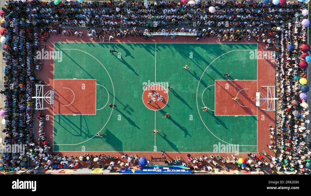 Players compete on a basketball court at a resettlement area in Pomei ...