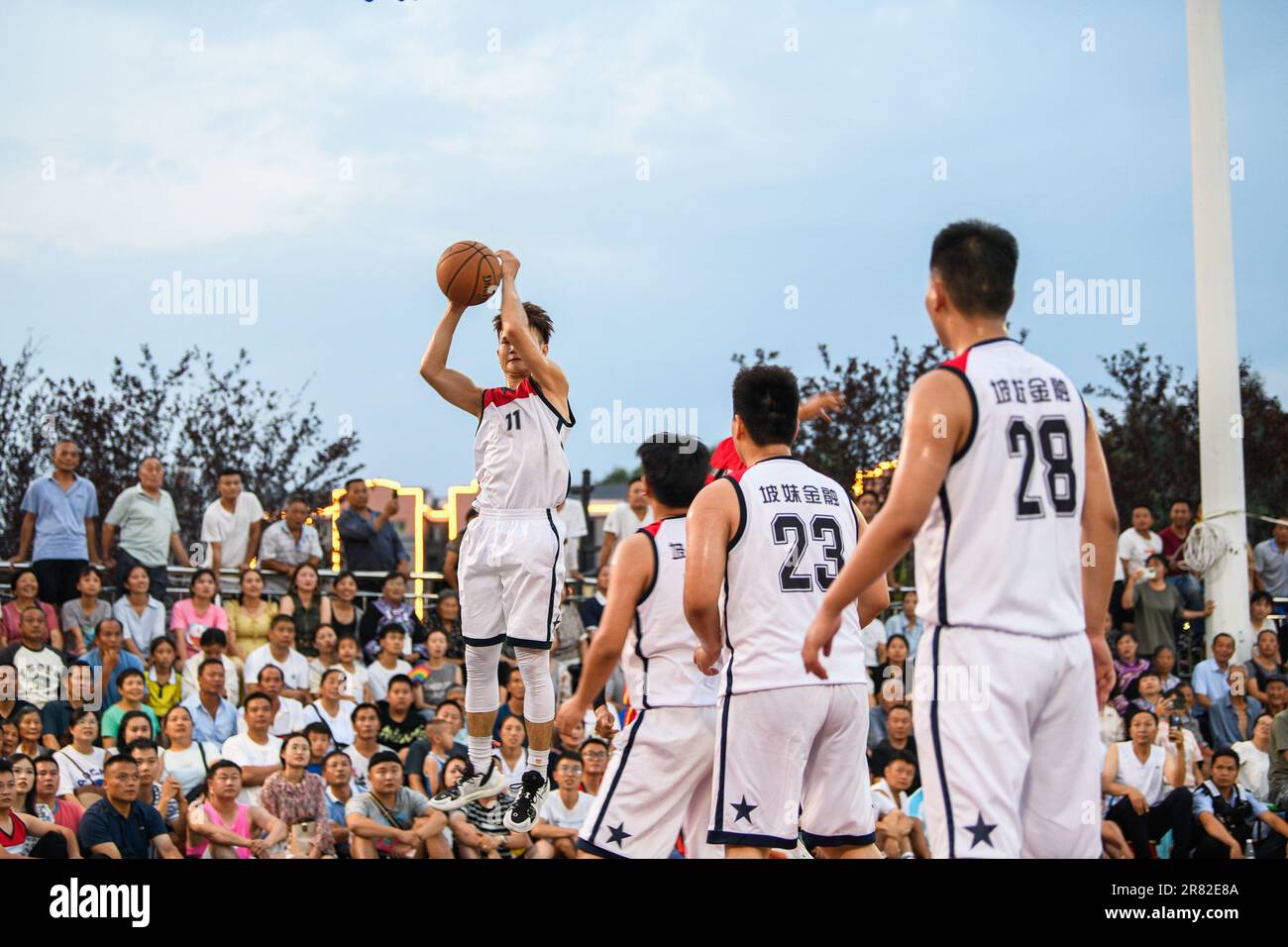 Players compete on a basketball court at a resettlement area in Pomei ...