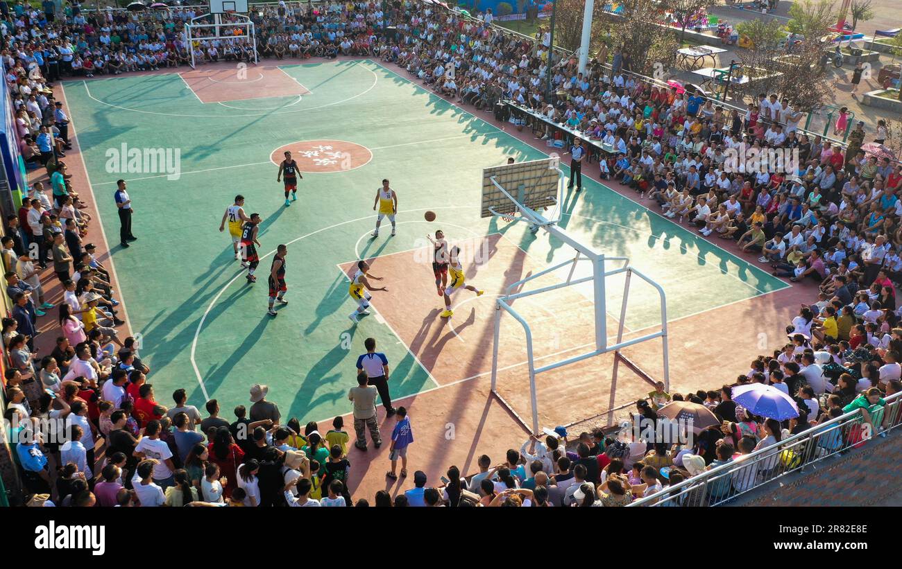 Players compete on a basketball court at a resettlement area in Pomei ...