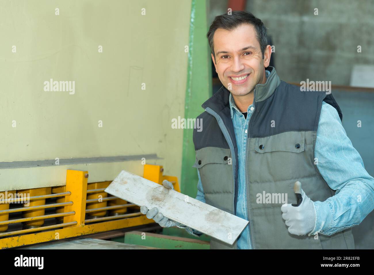 a happy man in factory Stock Photo - Alamy