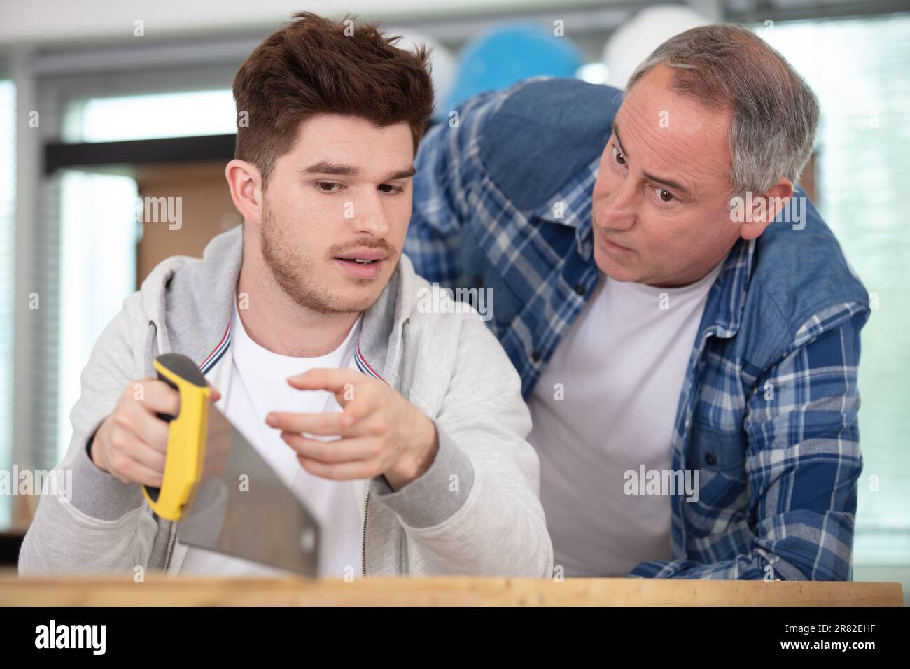 two men is working planer Stock Photo - Alamy