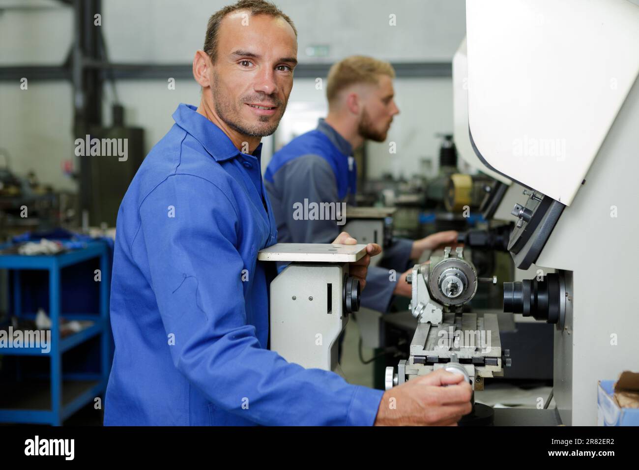 locomotive engineers craning engine parts in train works Stock Photo ...
