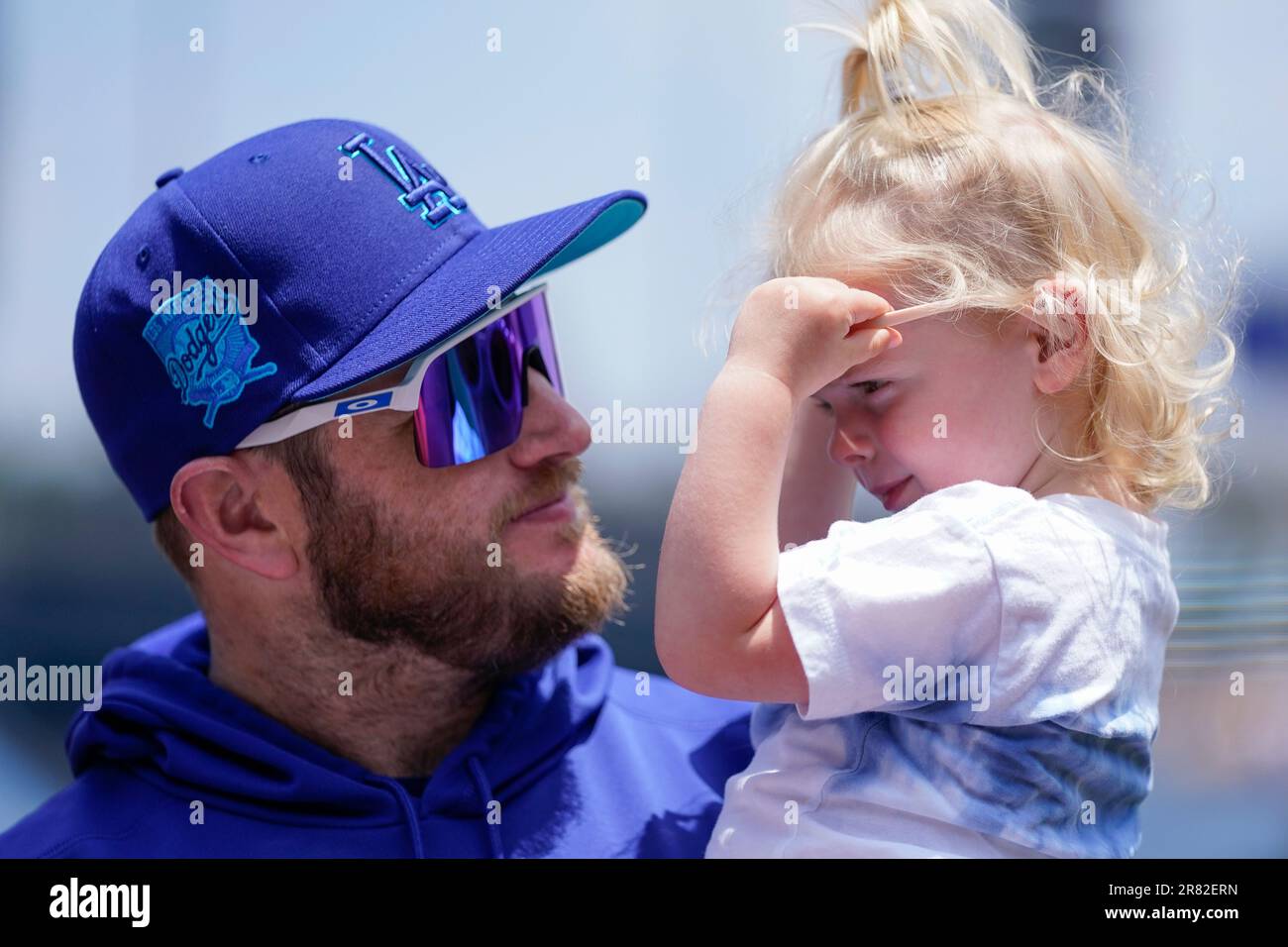Los Angeles Dodgers' Max Muncy holds his daughter, Sophie Kate Muncy ...