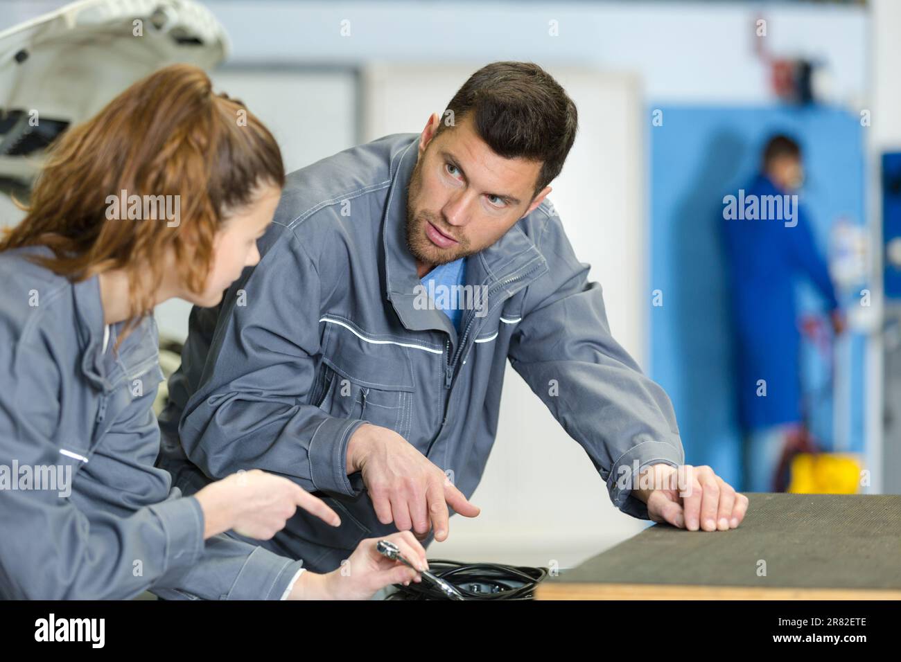 Woman asking colleague question hi-res stock photography and images - Alamy