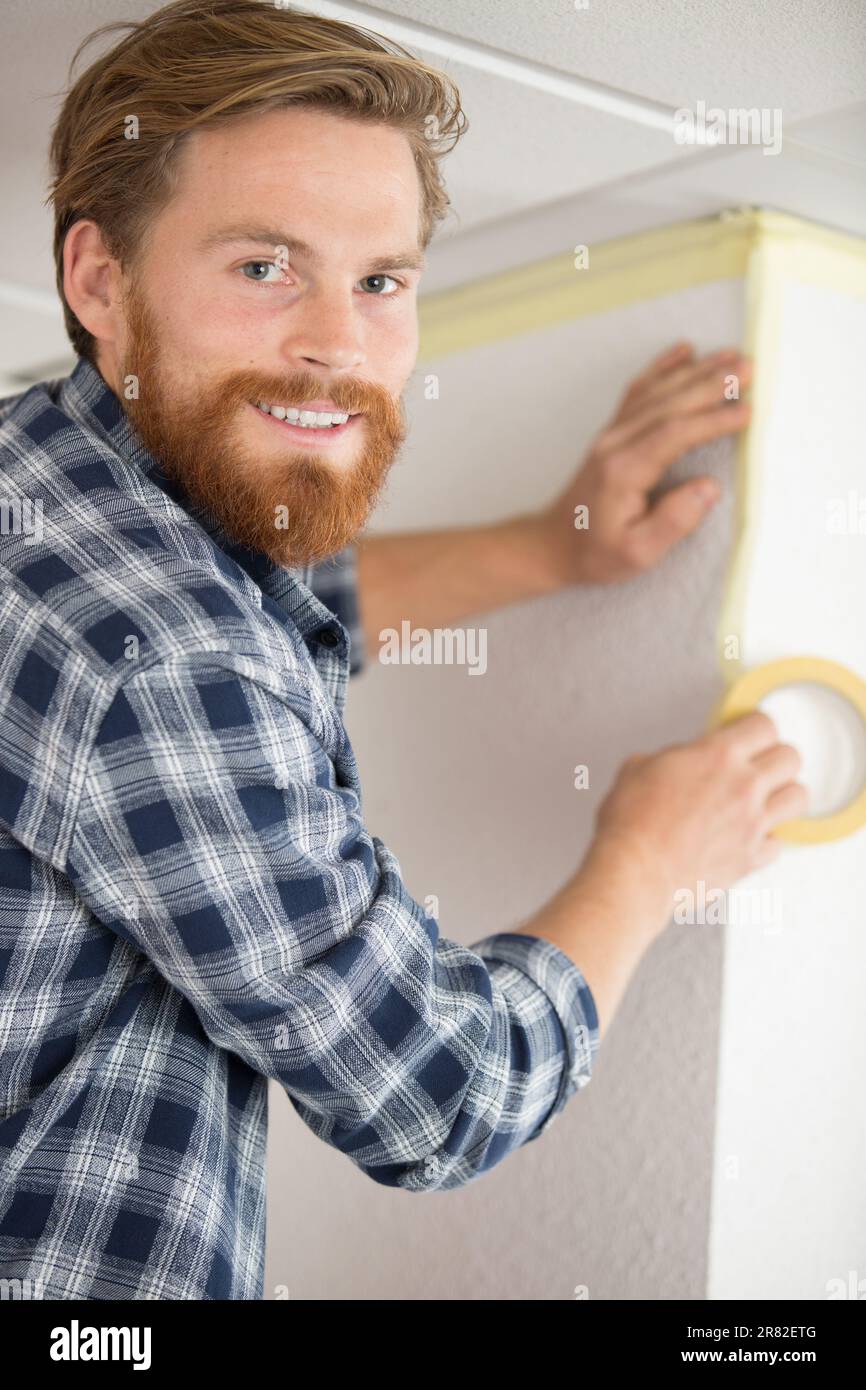 Worker putting tape on hi-res stock photography and images - Alamy