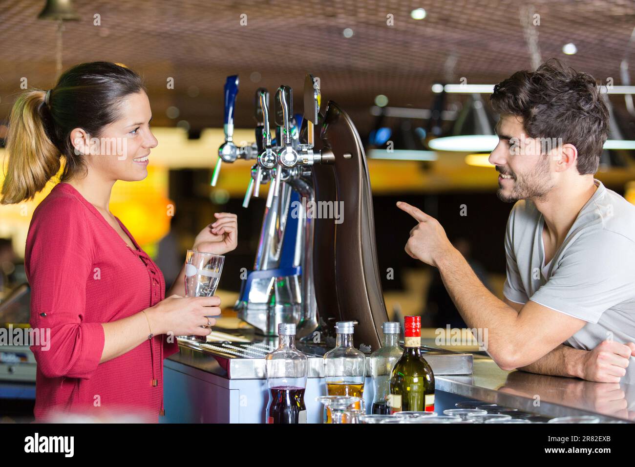 Bartender serving cocktail customer hi-res stock photography and images ...