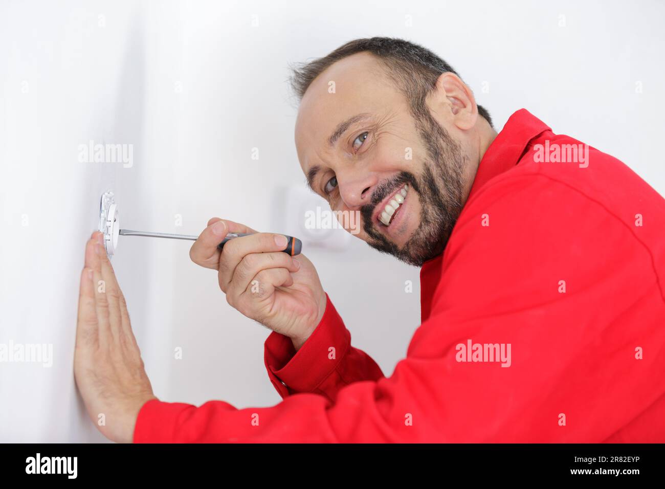 a happy electrician at work Stock Photo - Alamy