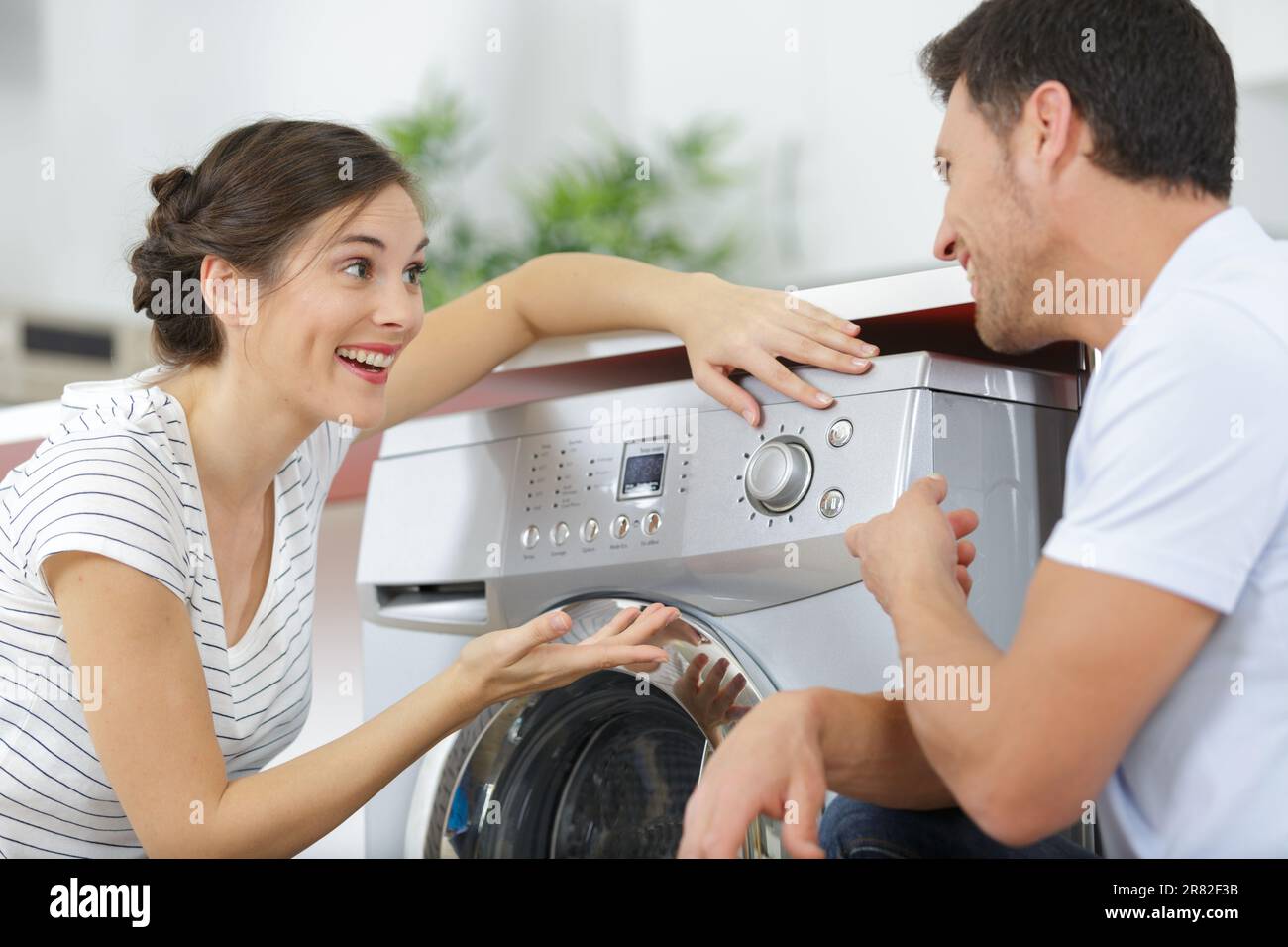 Couple shopping for washing machine hi-res stock photography and images ...