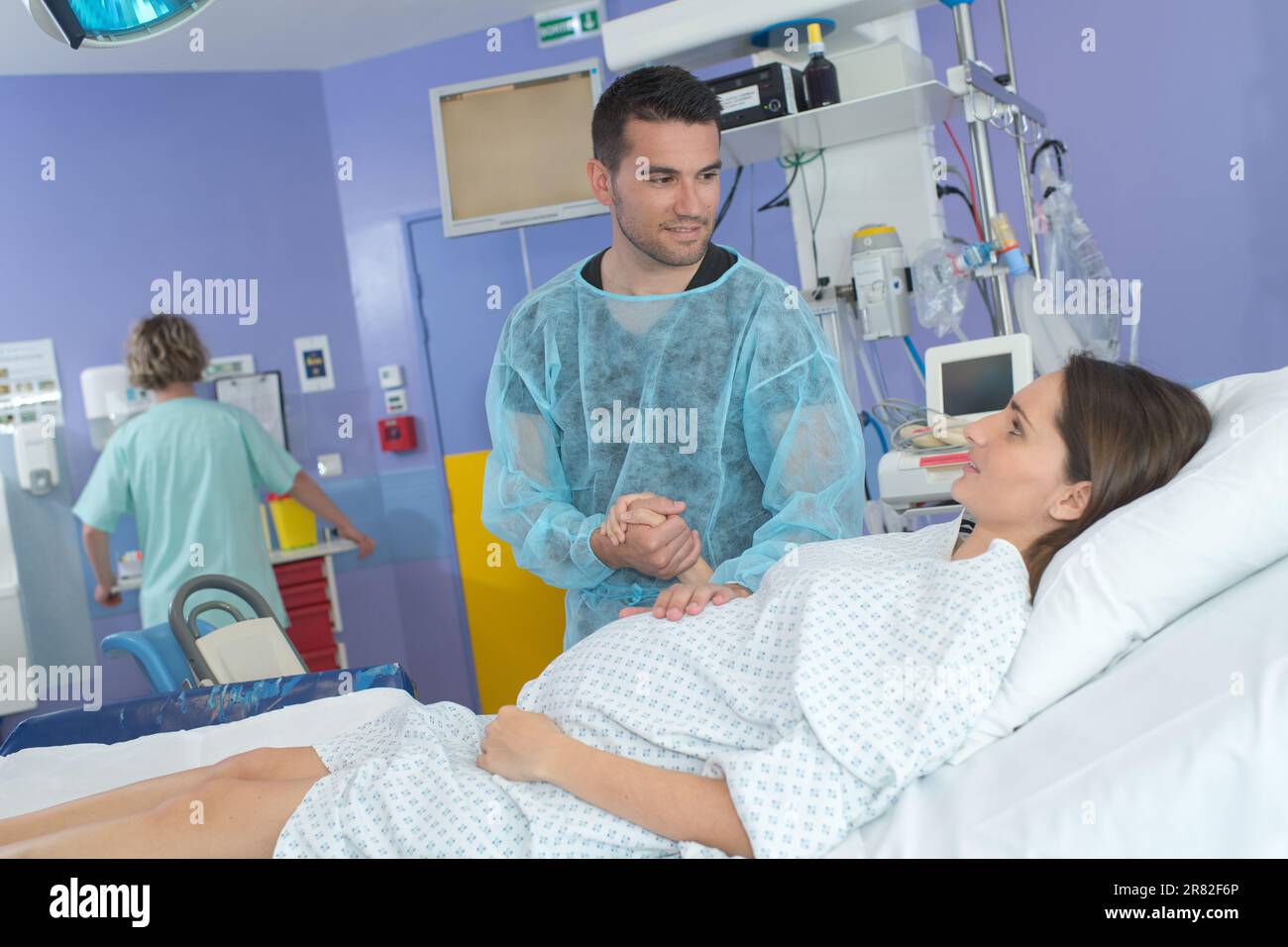 woman having contraction giving birth in hospital with husband Stock ...