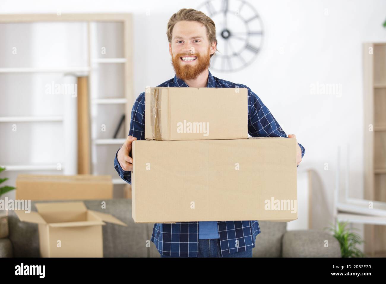 happy man holding package parcel boxes Stock Photo - Alamy