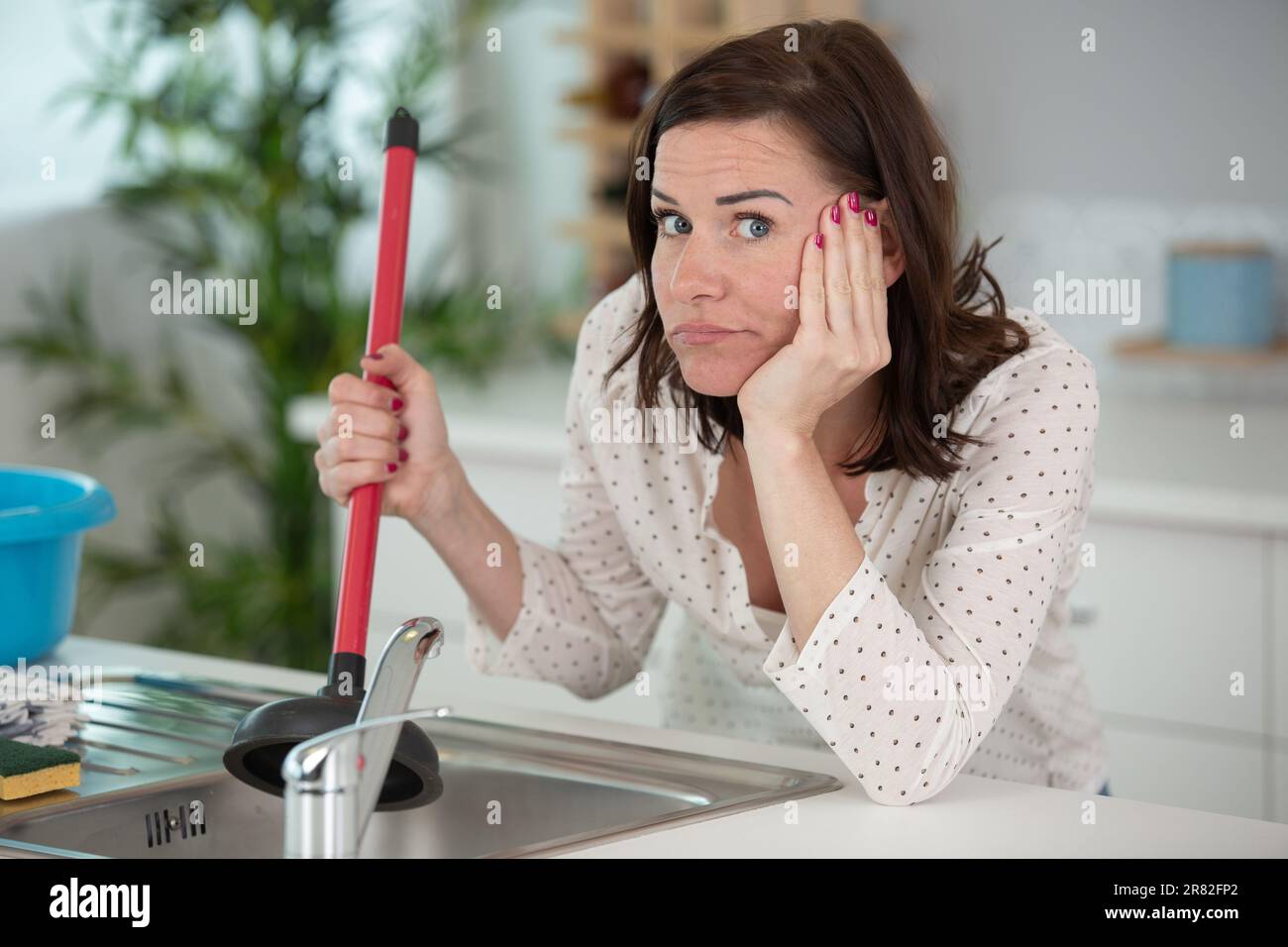 Angry tired housewife cleaning hi-res stock photography and images - Alamy