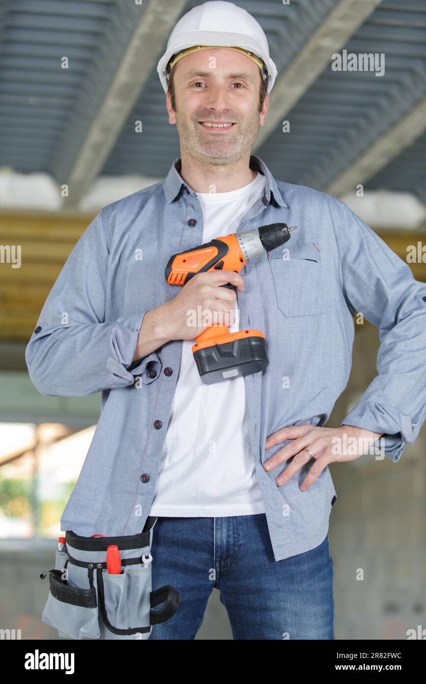 contractor employee with hand power drill Stock Photo - Alamy