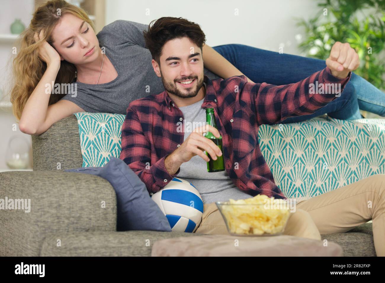 couple in conflict watching tv silently ignoring each other Stock Photo ...