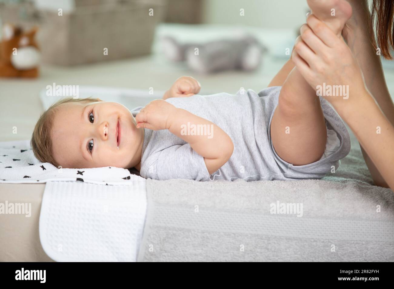 mother hands changing baby nappy Stock Photo - Alamy