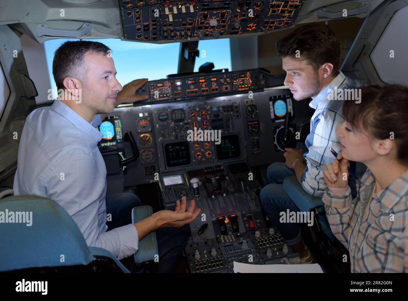 pilot and students in a airplane cockpit Stock Photo - Alamy