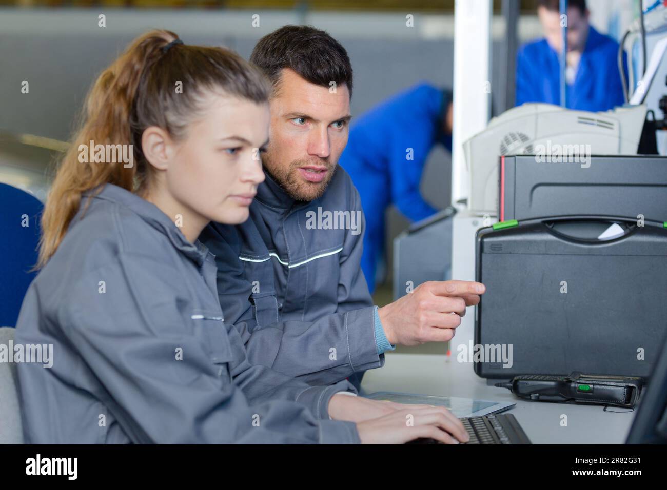 portrait of people using a garage computer Stock Photo - Alamy