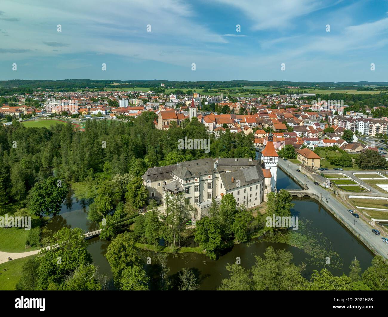 Aerial view of Blatna medieval water castle with towers, turrets, plus ...