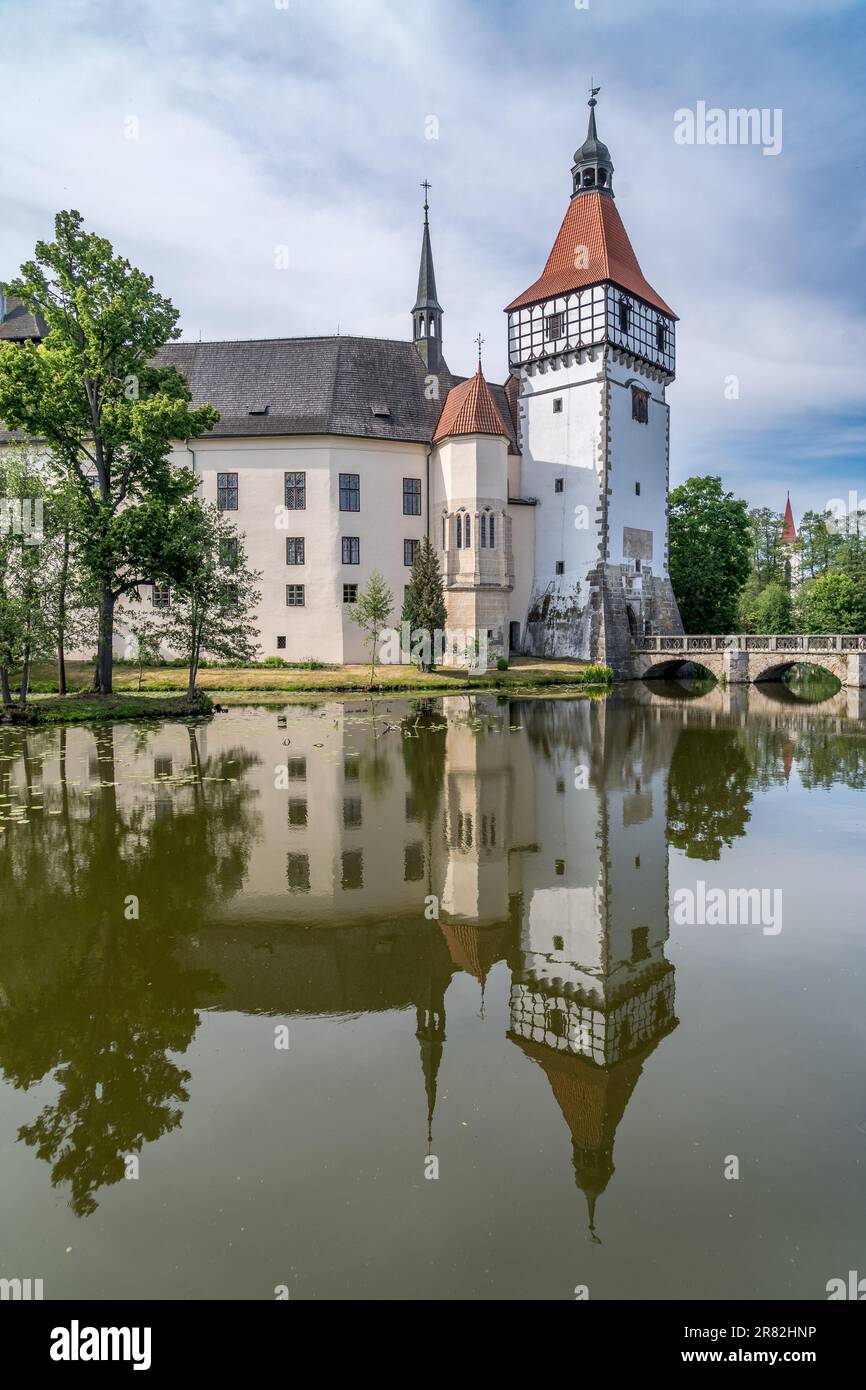 Aerial view of Blatna medieval water castle with towers, turrets, plus ...