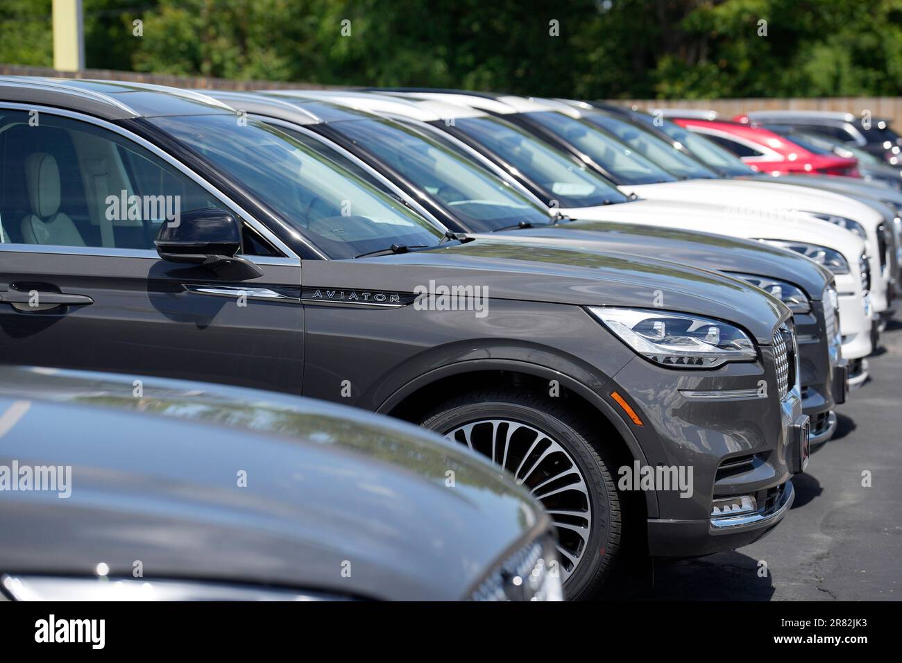 Unsold 2023 Aviator sports-utility vehicles sit in a long row at a ...