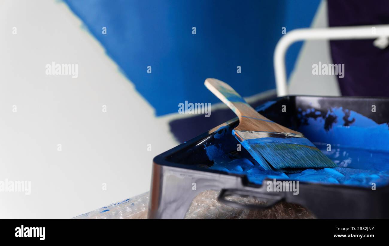 Painting wall. diy concept. Home interior improvement. Renovating house ...