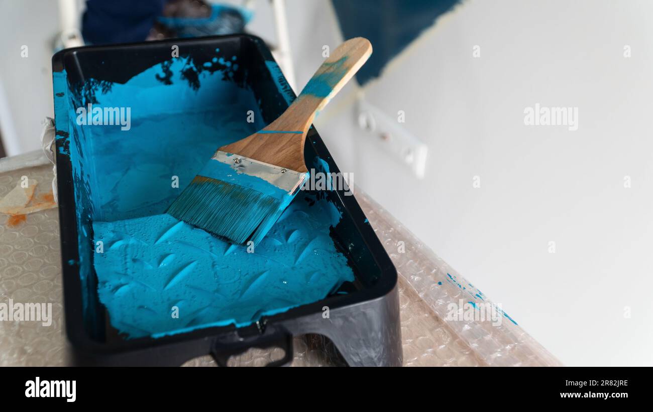 Painting wall. diy concept. Home interior improvement. Renovating house ...