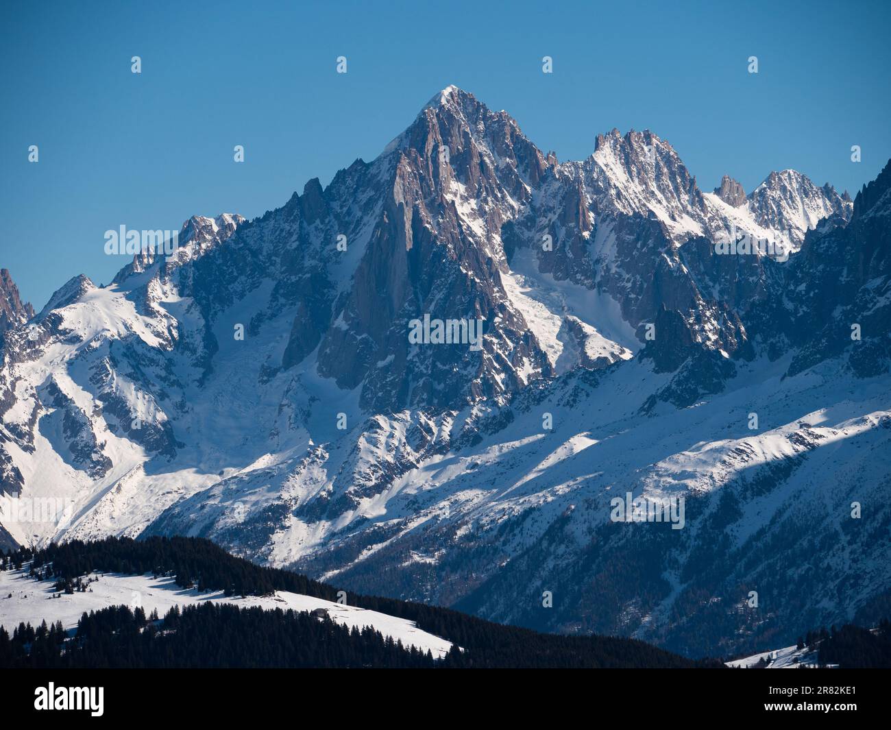 A majestic snow-capped Mont Blanc mountain range, with lush evergreen ...