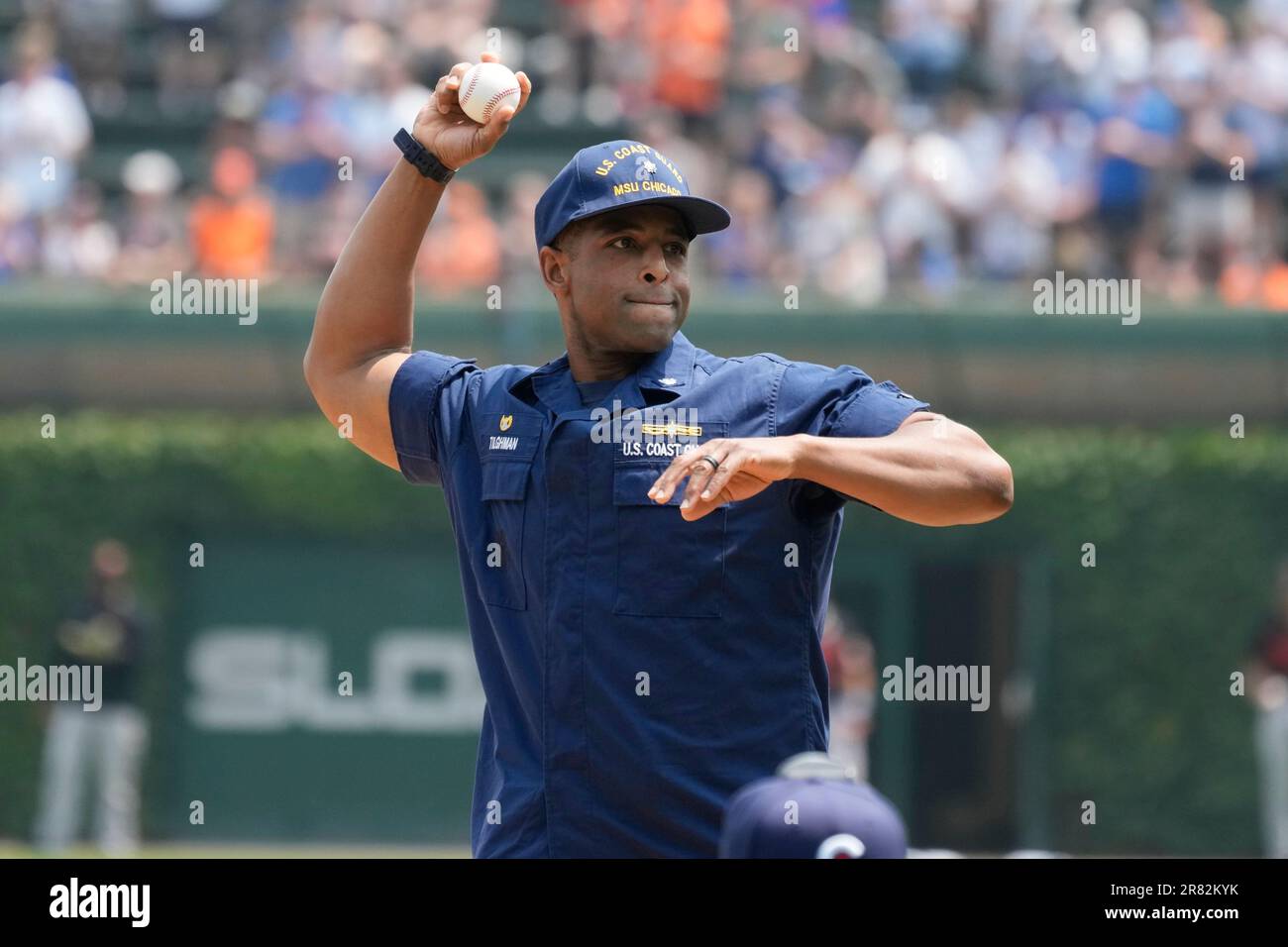 United States Coast guard CDR Timothy Tilghman throws out a ceremonial ...