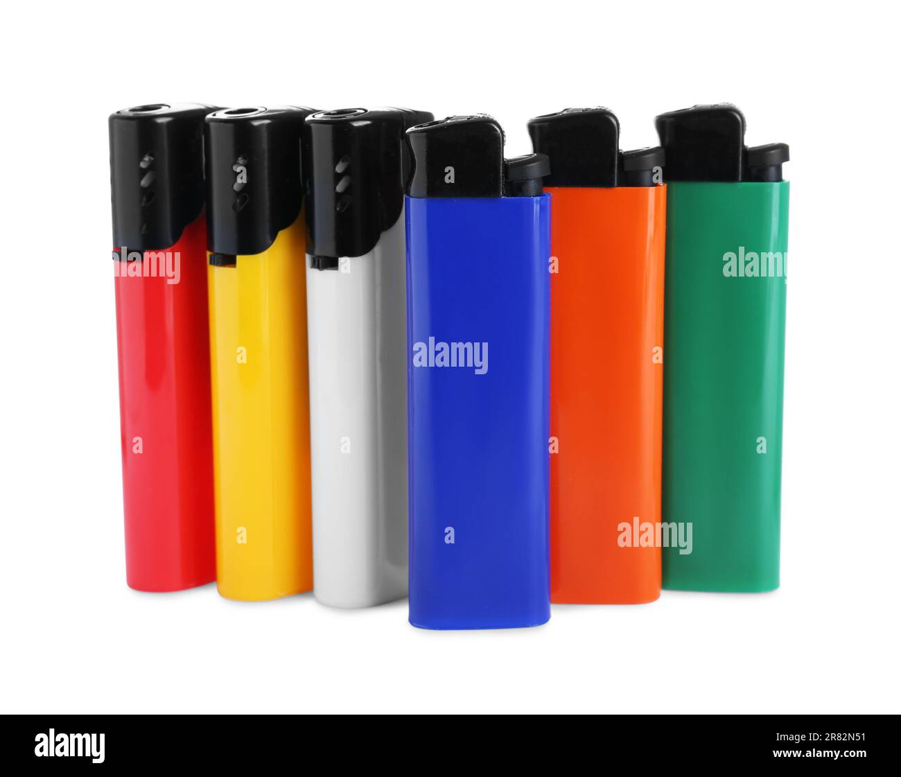 Stylish small pocket lighters on white background Stock Photo - Alamy