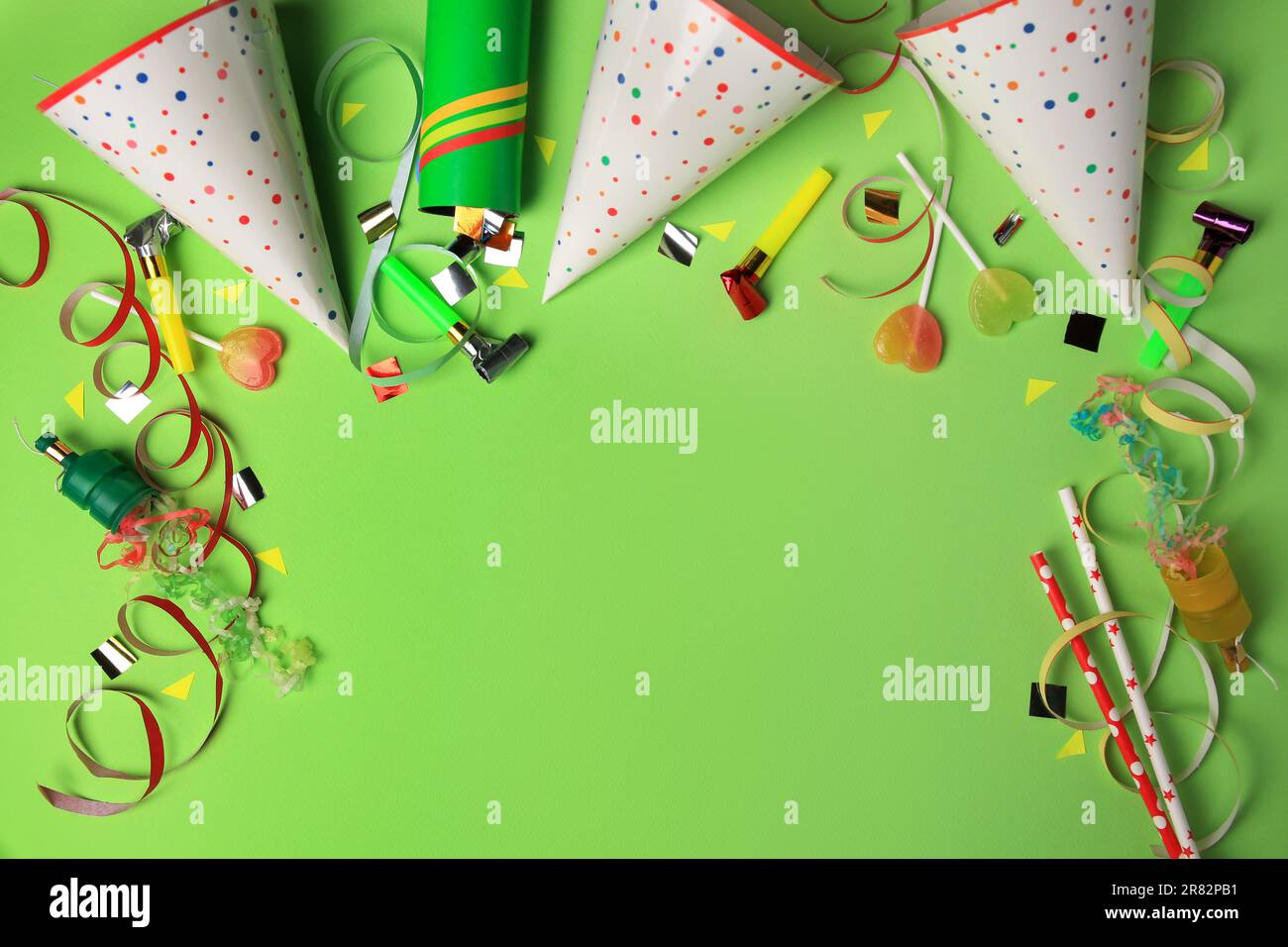 Party poppers with colorful streamers, blowers and festive decor on ...