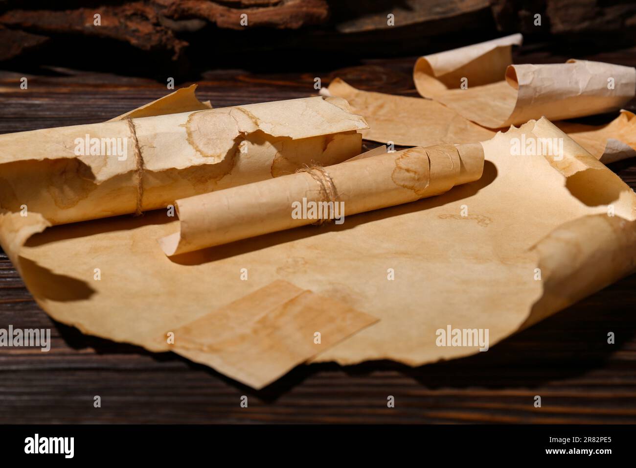 Sheets of old parchment paper on wooden table Stock Photo - Alamy