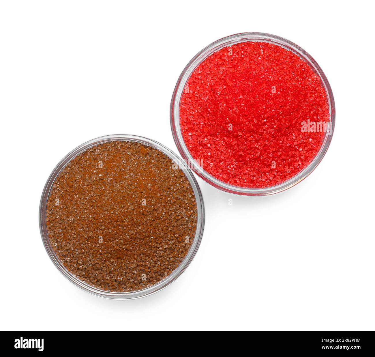 Glass bowls with brown and red food coloring isolated on white, top ...