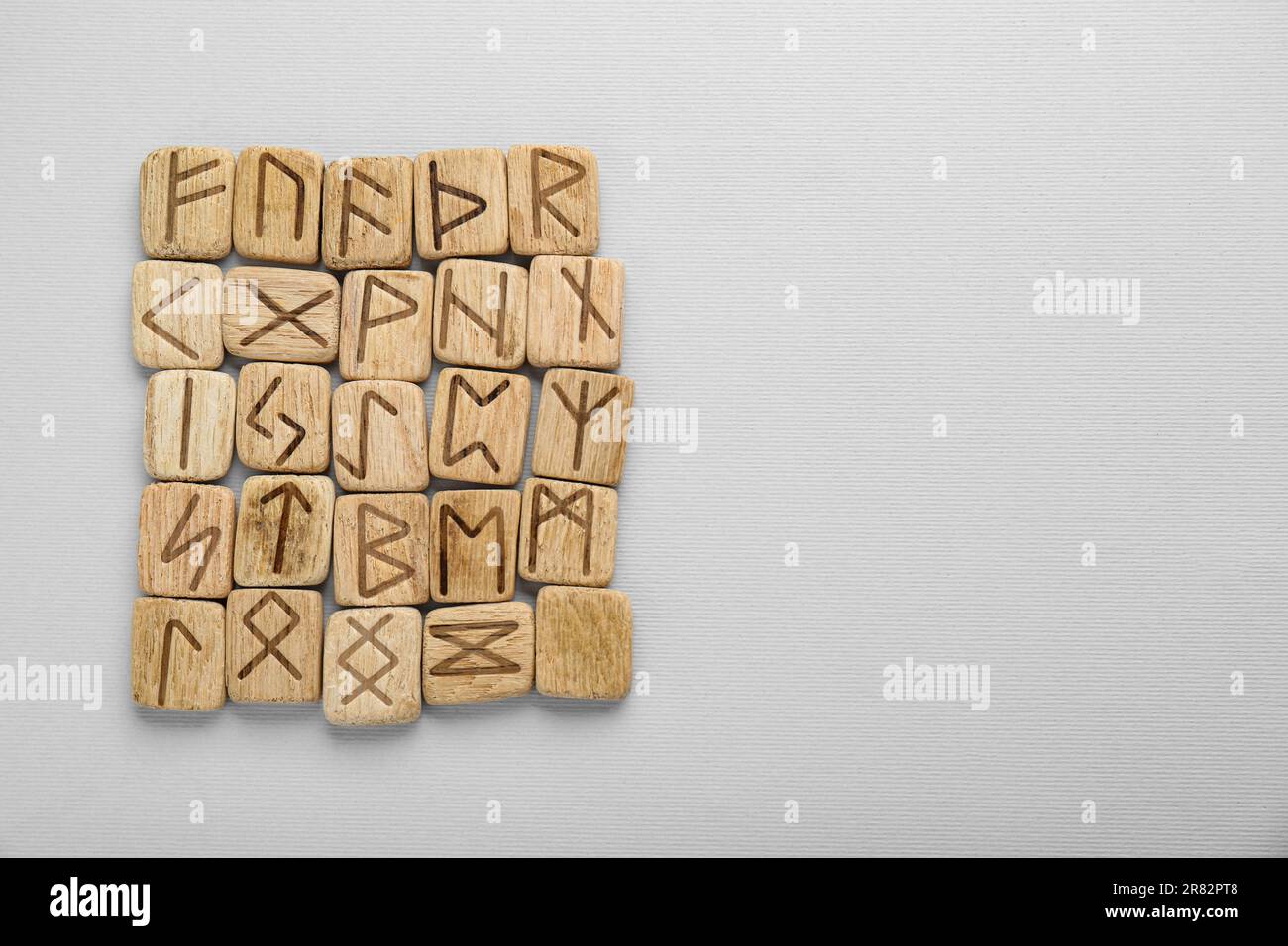Wooden runes on white background, top view. Space for text Stock Photo ...