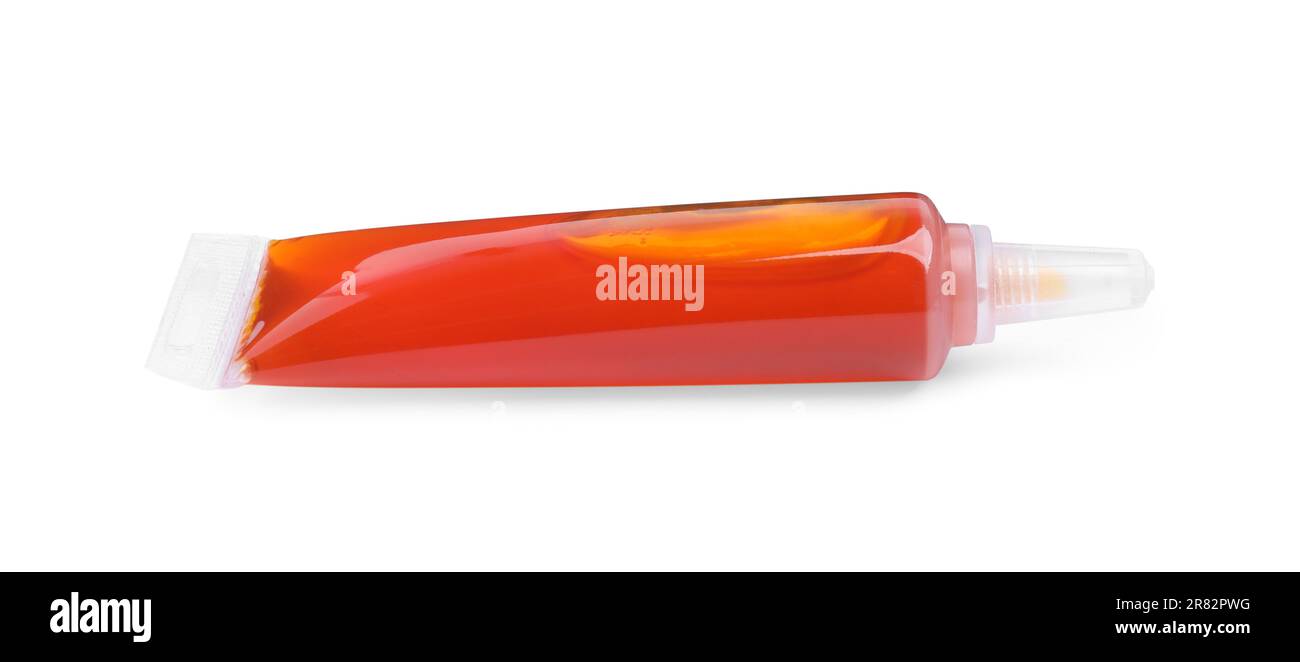 Tube with orange food coloring on white background Stock Photo - Alamy