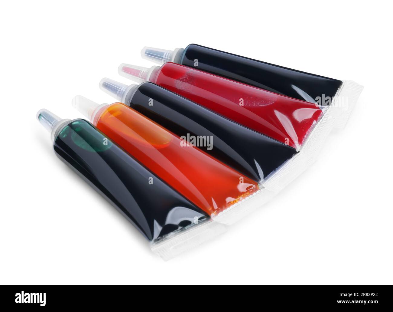 Tubes with different food coloring on white background Stock Photo - Alamy