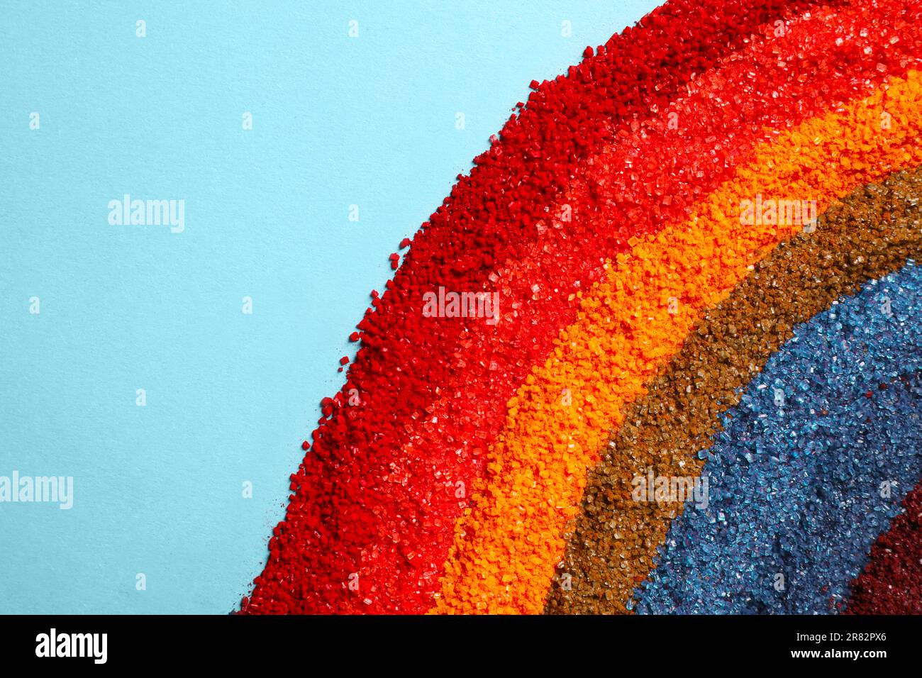 Different bright food coloring on light blue background, flat lay ...