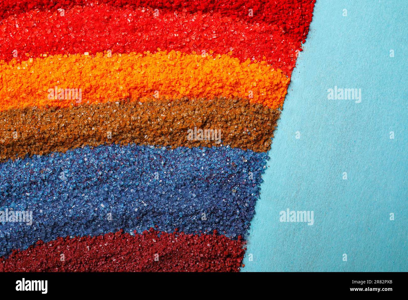 Different bright food coloring on light blue background, closeup Stock ...