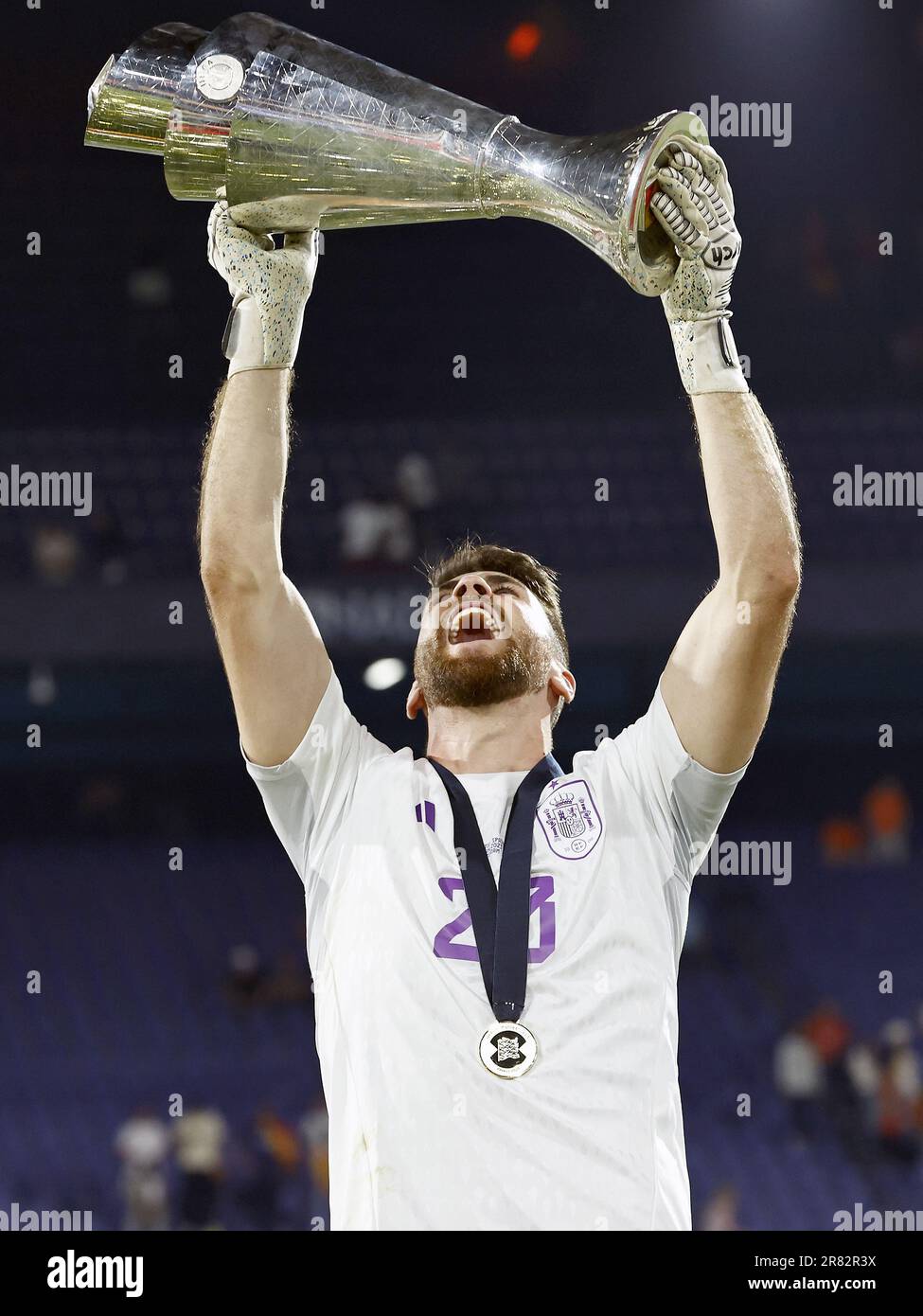 ROTTERDAM - Spain goalkeeper Unai Simon lifts the Nations League trophy ...