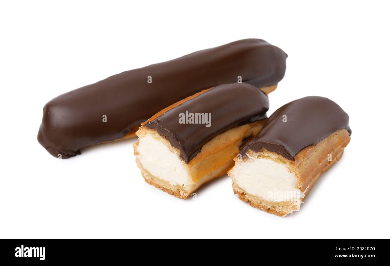 Cut and whole delicious eclairs covered with chocolate isolated on ...