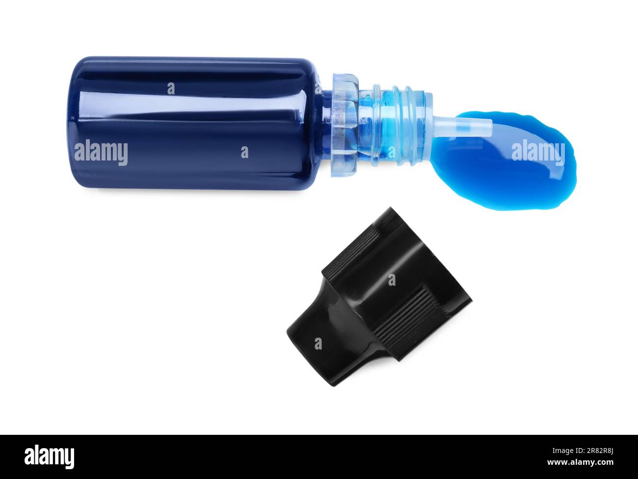 Bottle of blue food coloring on white background, top view Stock Photo ...