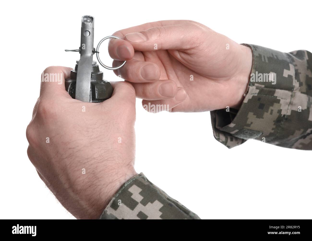Soldier pulling safety pin out of hand grenade on white background ...