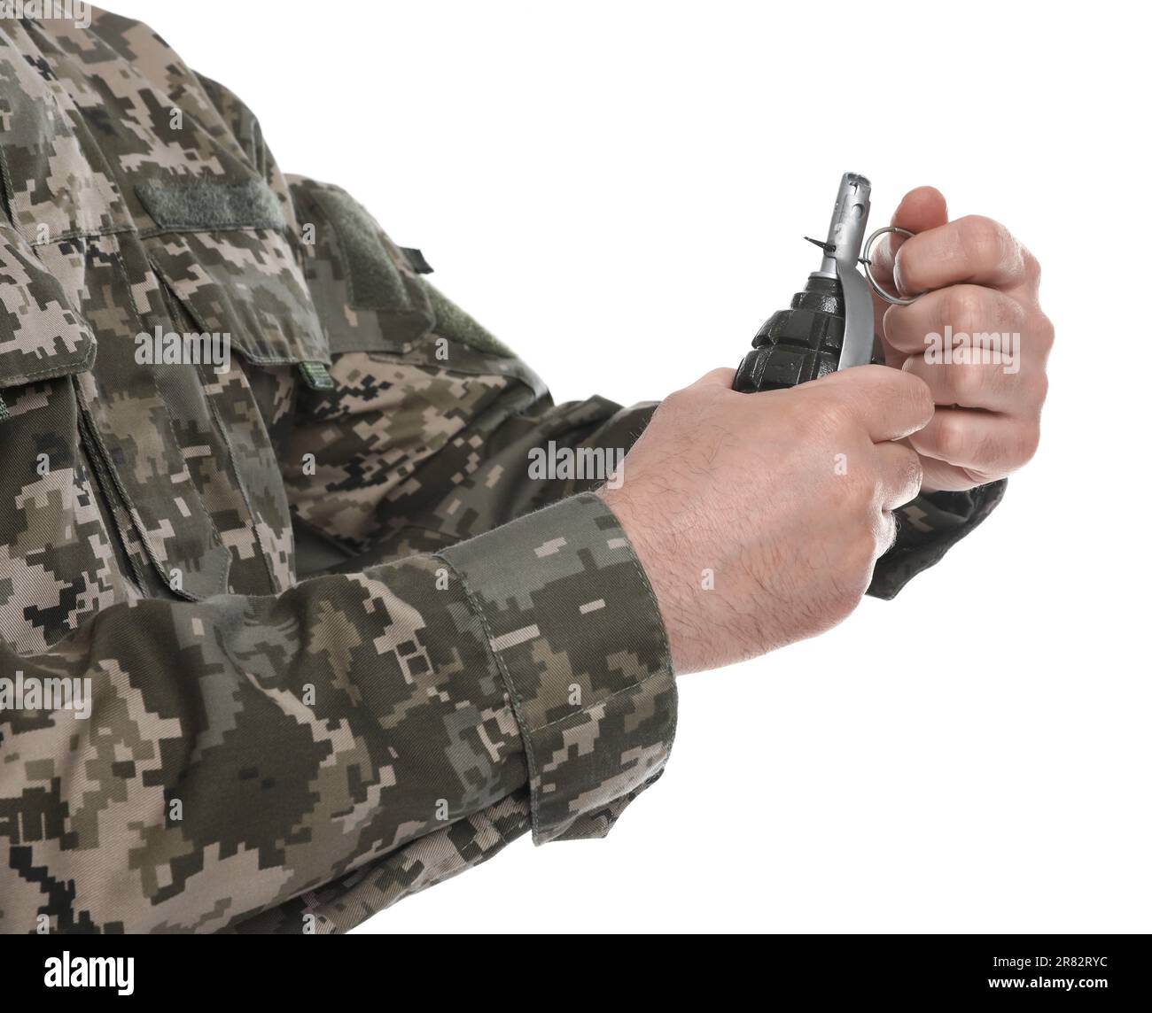 Soldier pulling safety pin out of hand grenade on white background ...