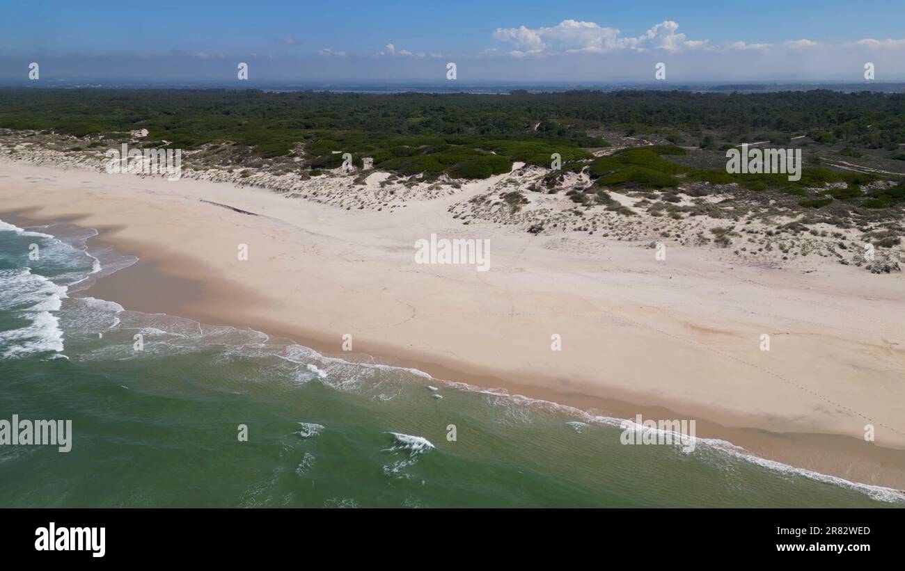Side view of waves crashing on sandy beach aerial - a bird's eye view ...