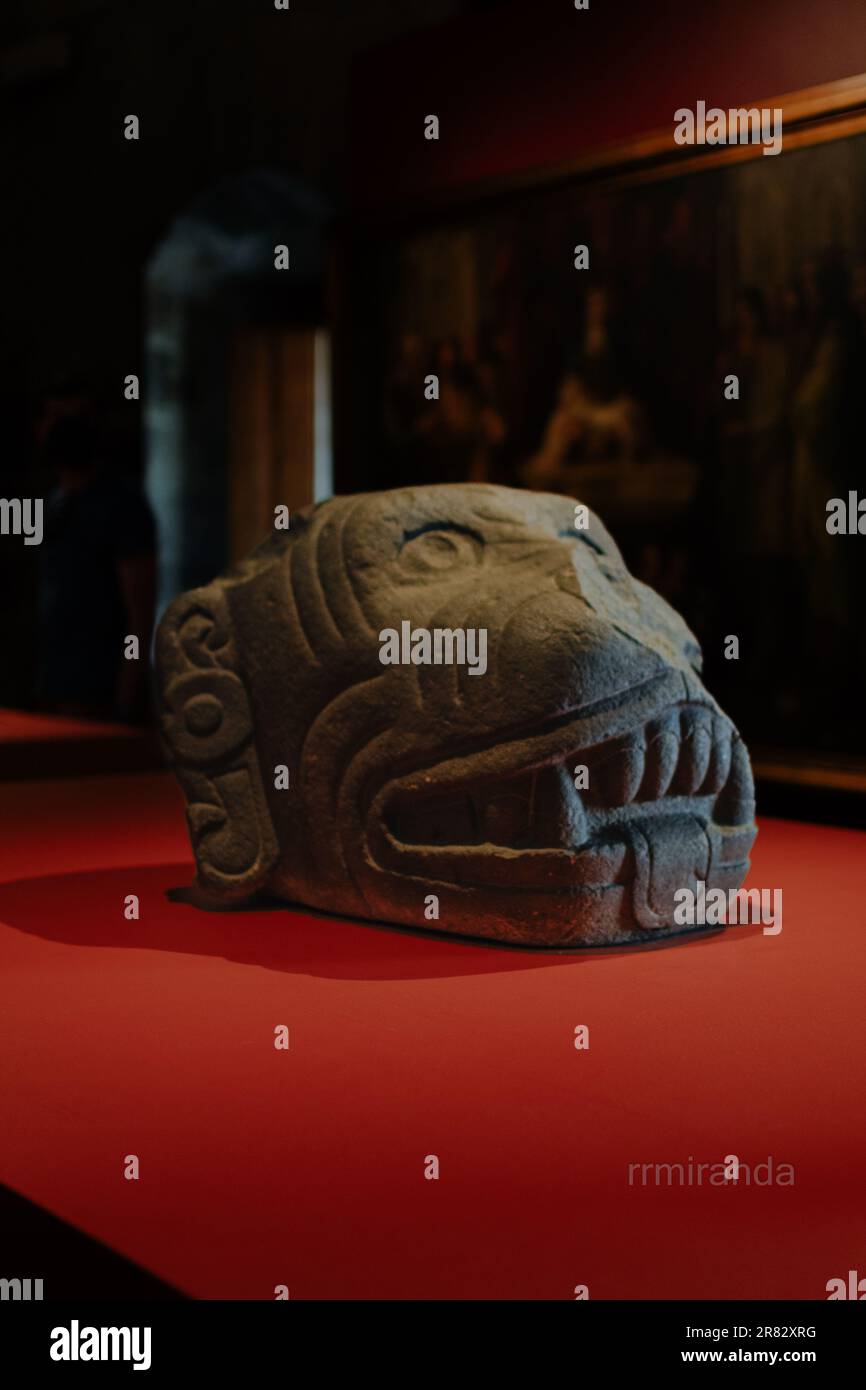 An intricately detailed Ancient Mesoamerican Statue prominently ...