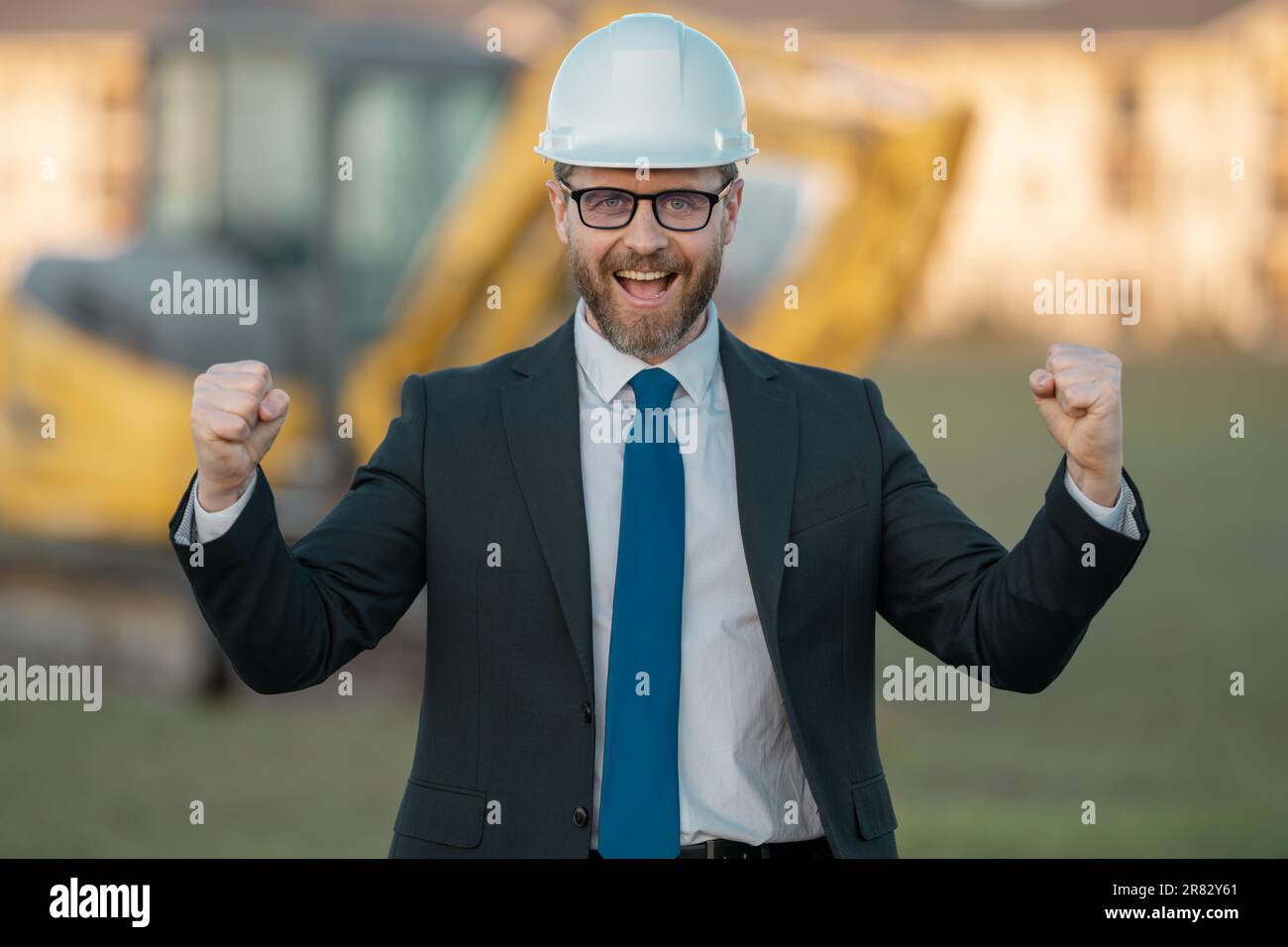 Successful construction business owner. Construction worker in suit and ...