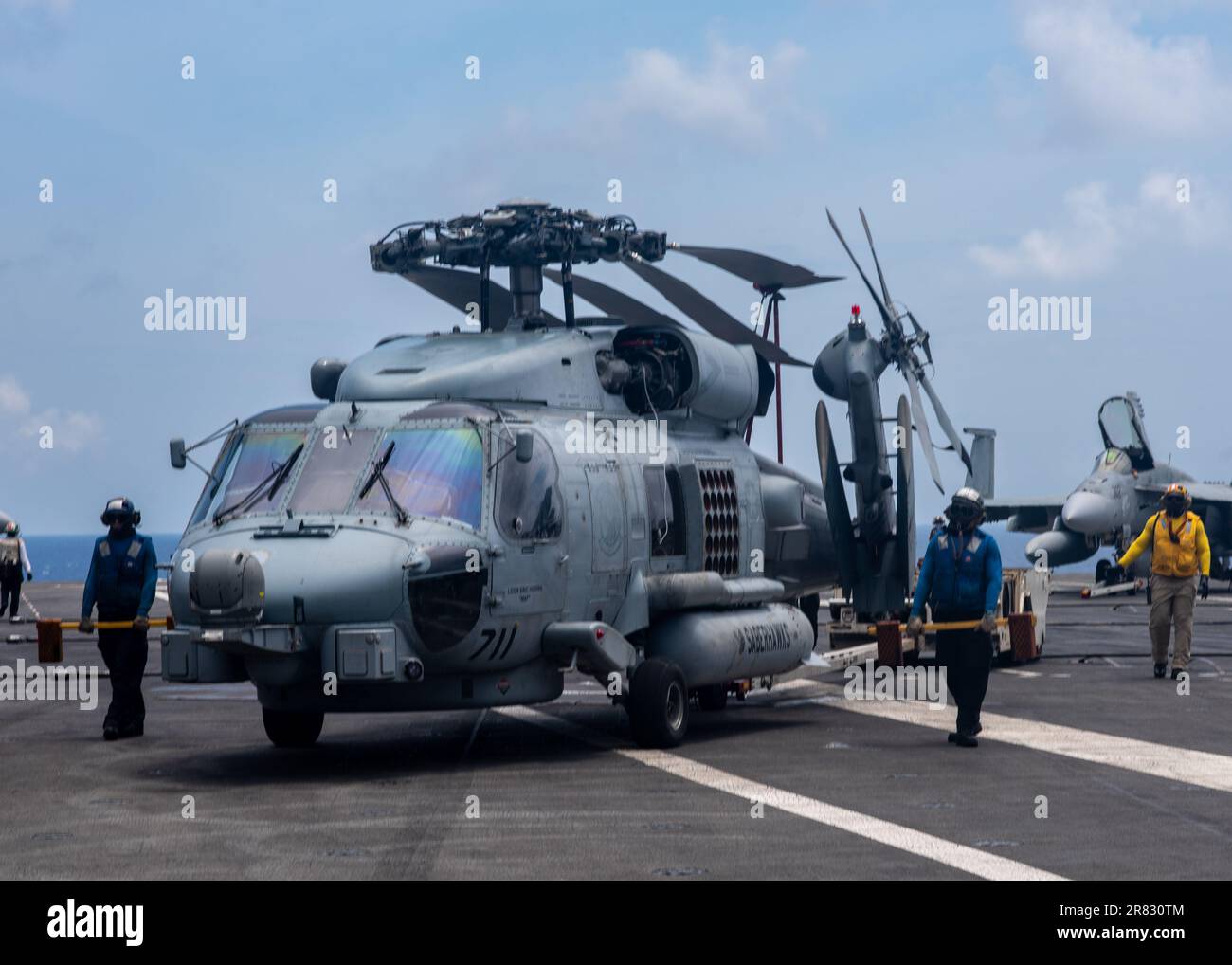 230616-N-UF592-1011 SOUTH CHINA SEA (June 16, 2023) Sailors maneuver an ...