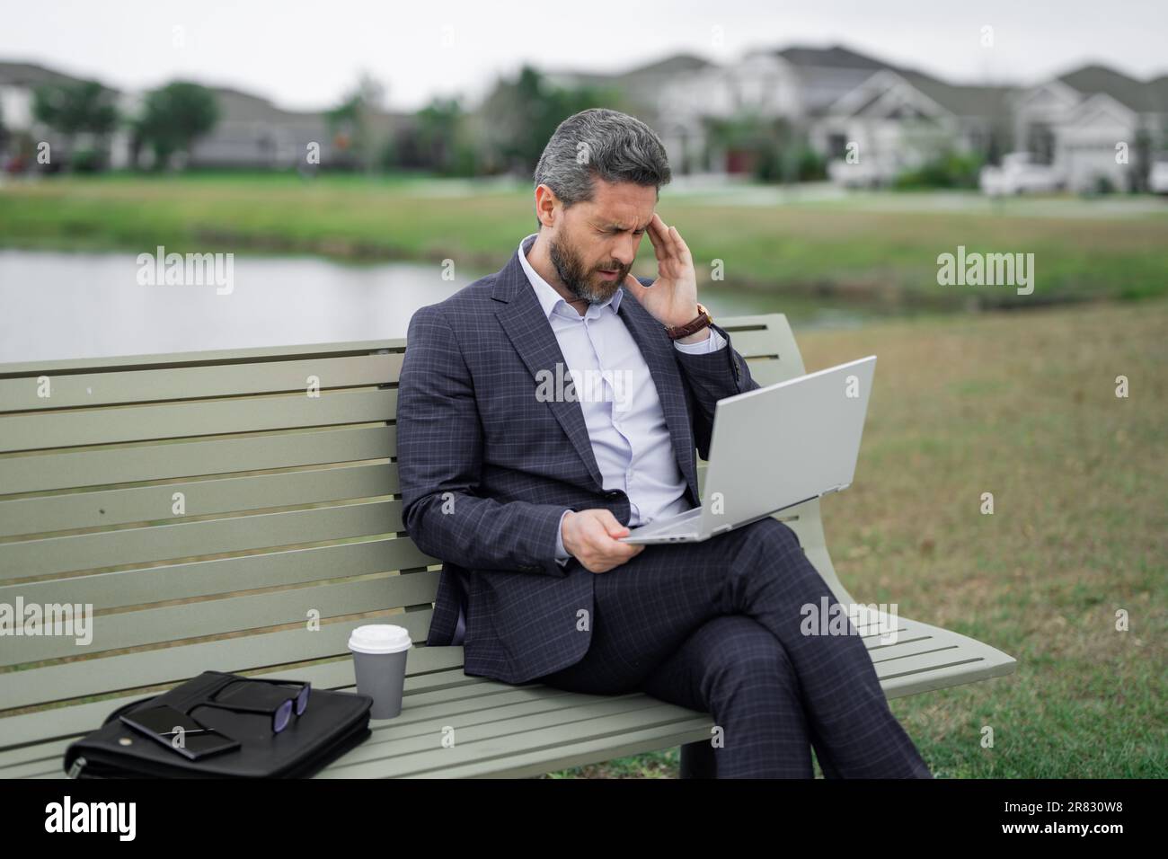 Bored upset tired business man in suit sitting on bench. Tired ceo ...