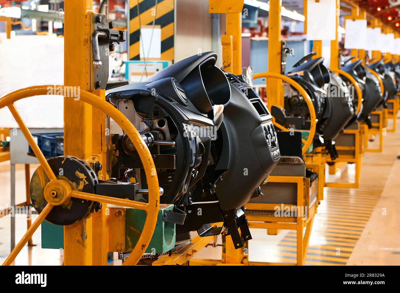 Assembled car dashboards on an assembly line. Automobile manufacturing ...