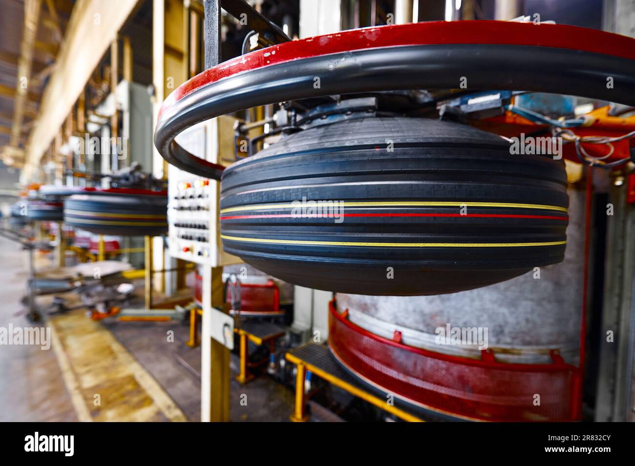 Huge raw tire before vulcanization process by press machine Stock Photo ...